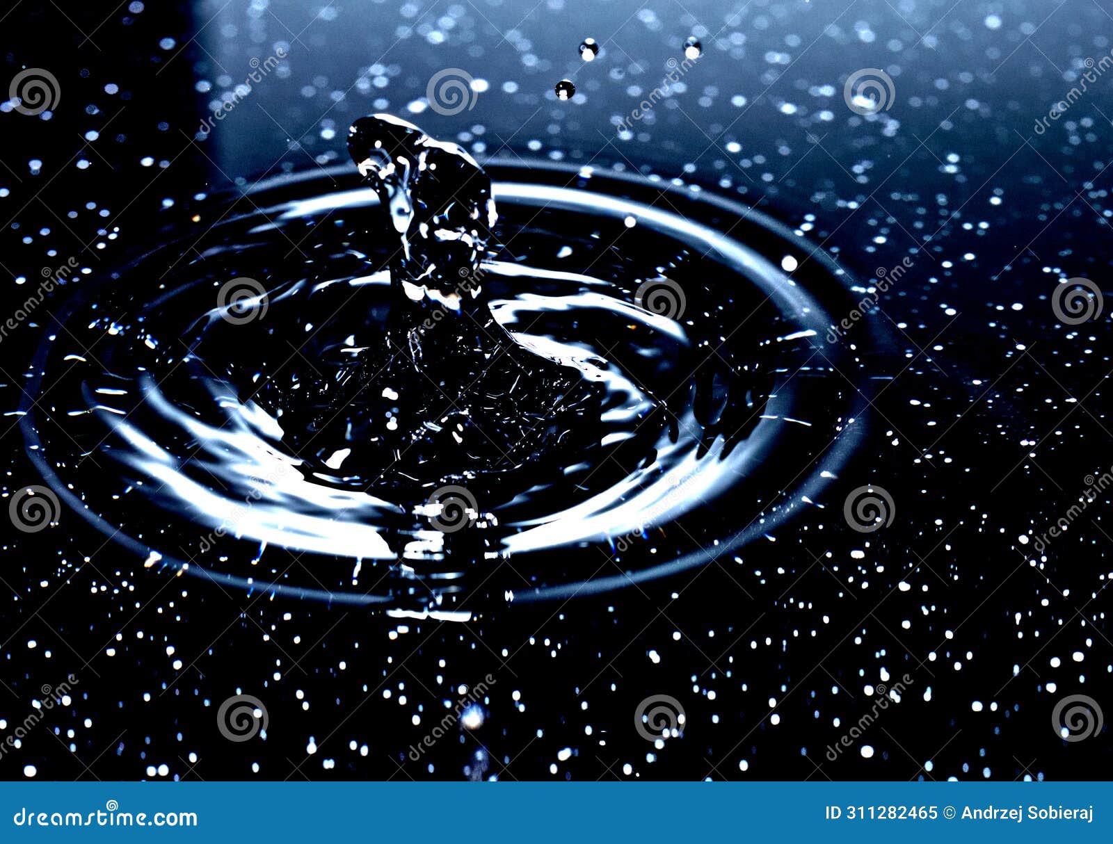 Splash - a Drop of Water Falling into the Water in a Macro Shot Stock ...