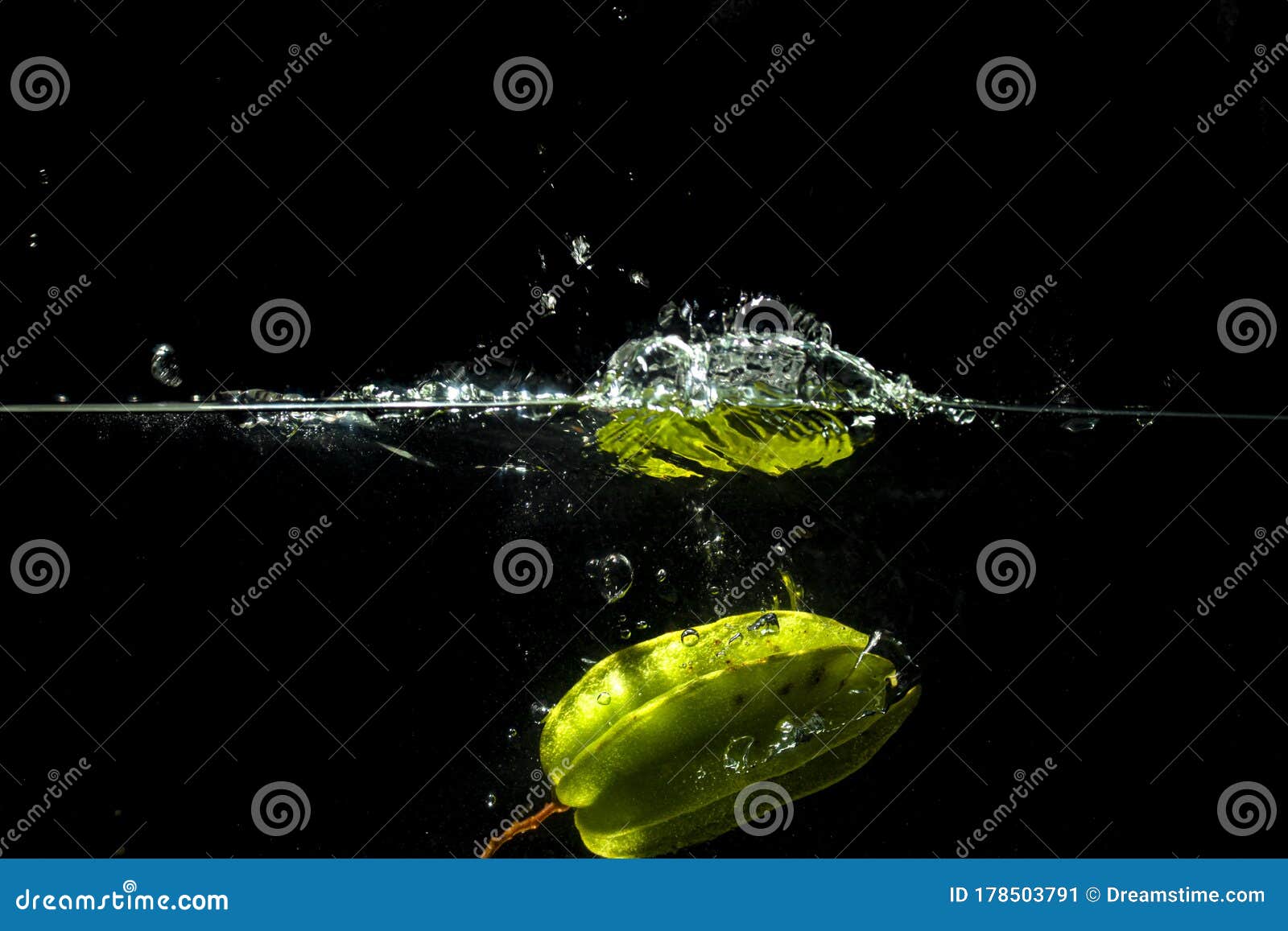 Splash of Fresh Starfruit Water on a Black Background Stock Image ...