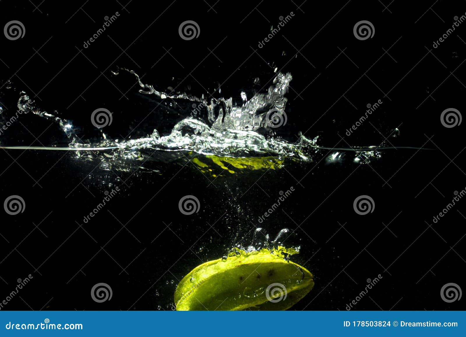 Splash of Fresh Starfruit Water on a Black Background Stock Photo ...