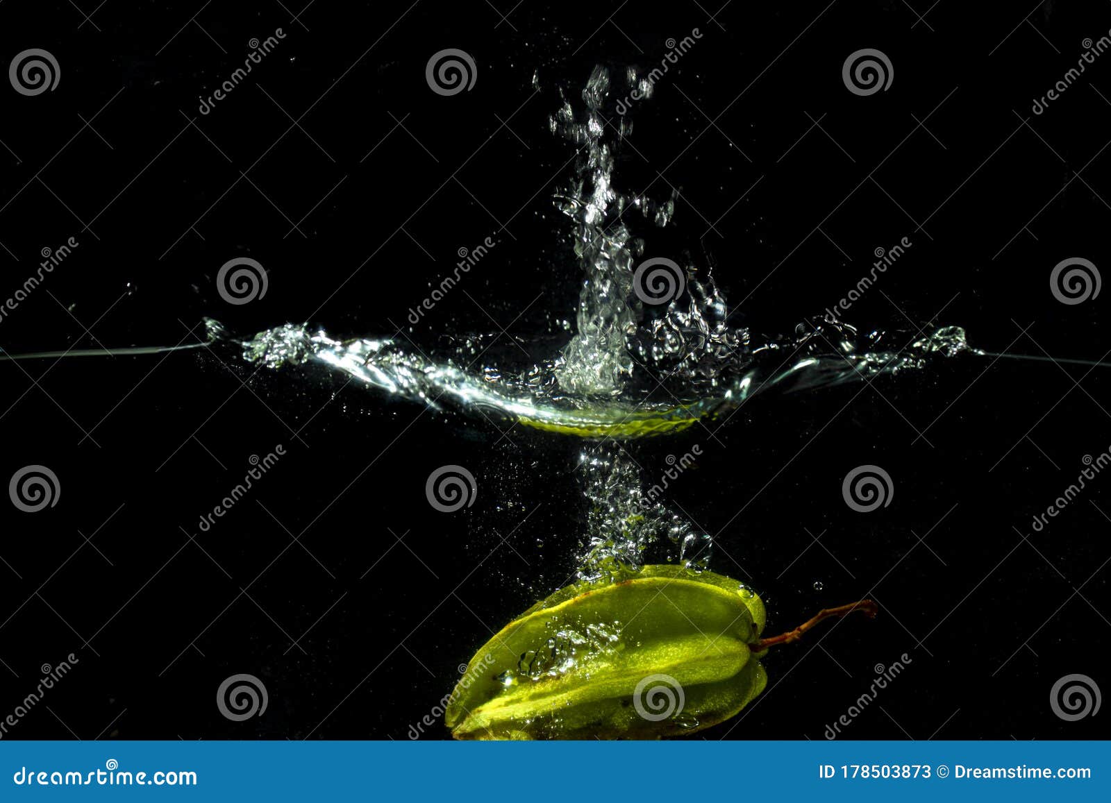 Splash of Fresh Starfruit Water on a Black Background Stock Image ...