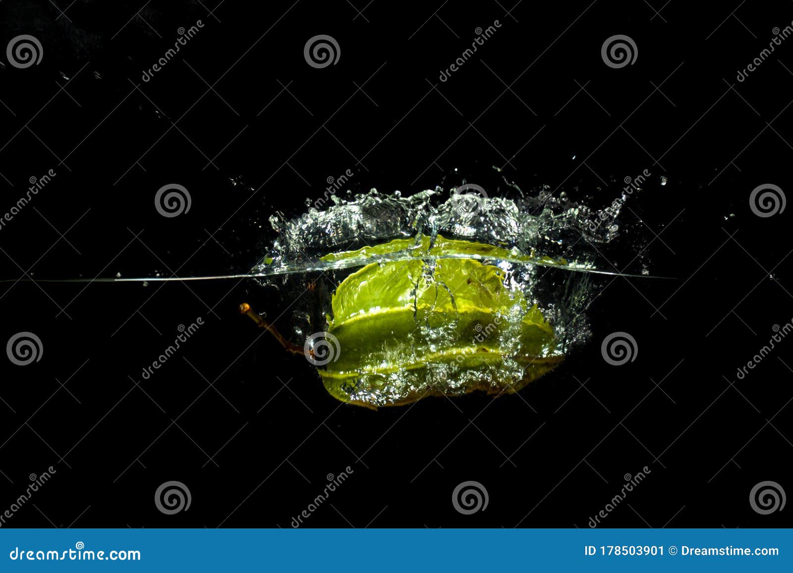 Splash of Fresh Starfruit Water on a Black Background Stock Image ...