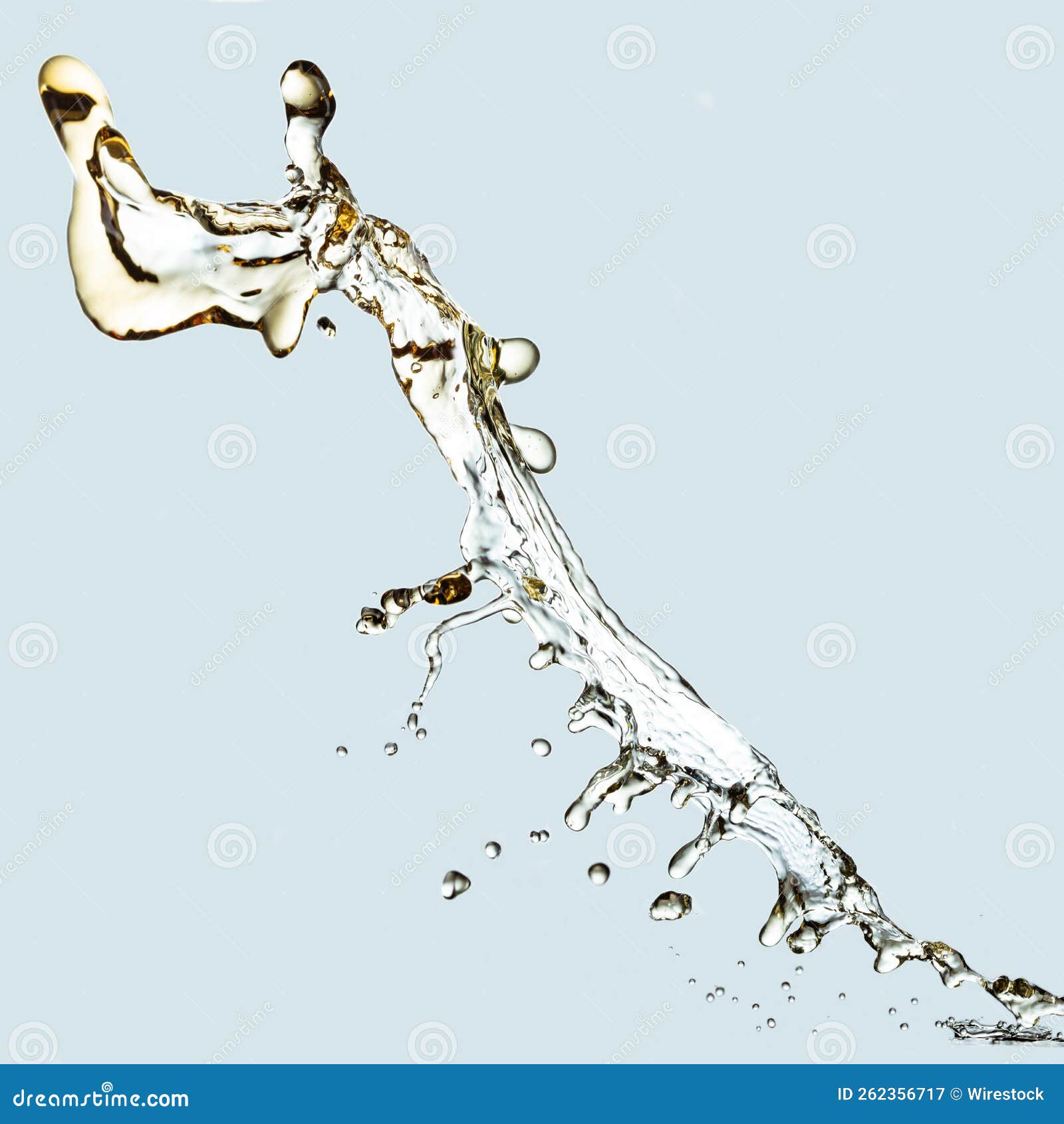 Splash of Liquid on a Light Blue Background Stock Image - Image of ...