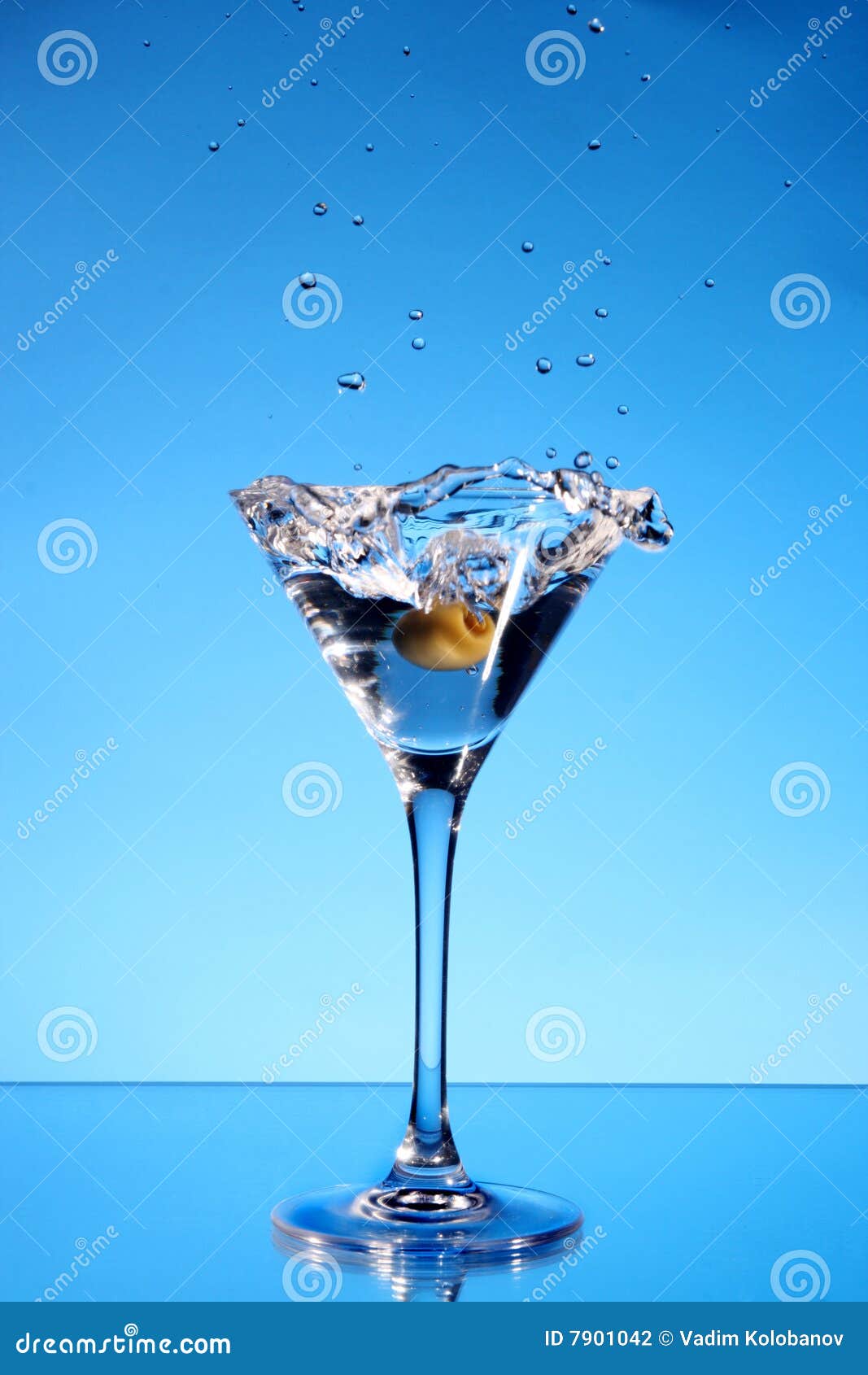 Splash martini on blue stock photo. Image of glass, drink - 7901042