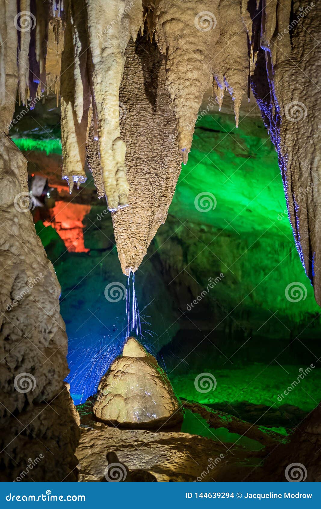 Splashes of Water from a Stalactite Creating a Stalagmite Beneath it in ...
