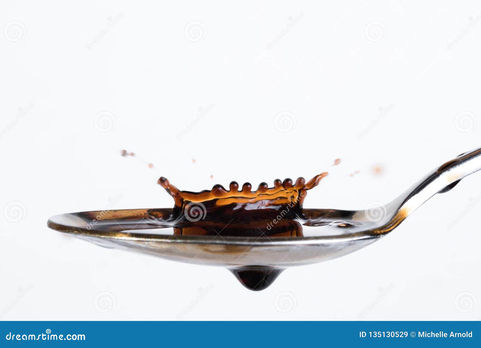 A Splash of Vanilla Extract Stock Image - Image of closeup, white ...