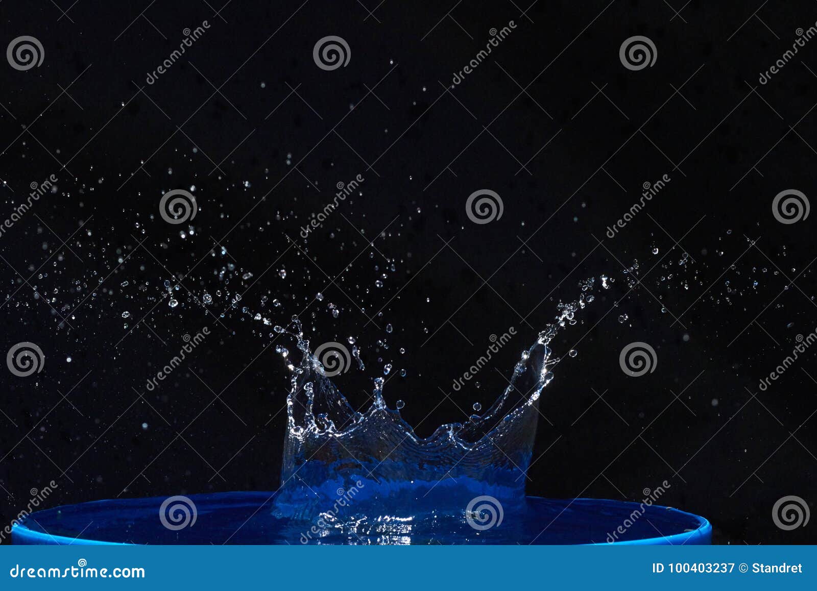 Splash of Water Crown on Blue Surface. Stock Image - Image of liquid ...