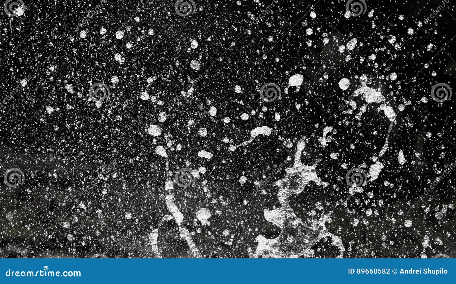 Splash of Water in the Form of Rain on a Black Background Stock Photo ...