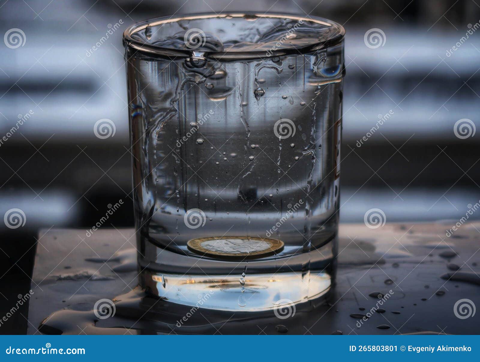 Splash of Water in a Glass from a Tossed Coin Stock Image - Image of ...