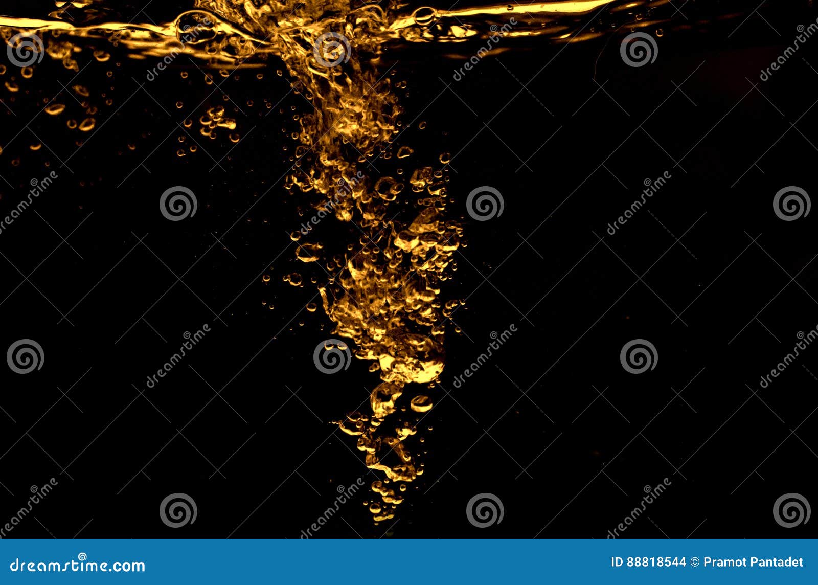 Splash Water Yellow Gold with Bubbles of Air on Black Background Stock ...