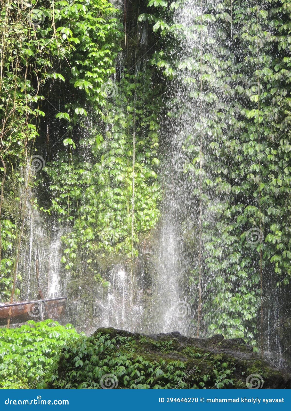 The Splash of the Waterfall is Spread Evenly Against the Background of ...