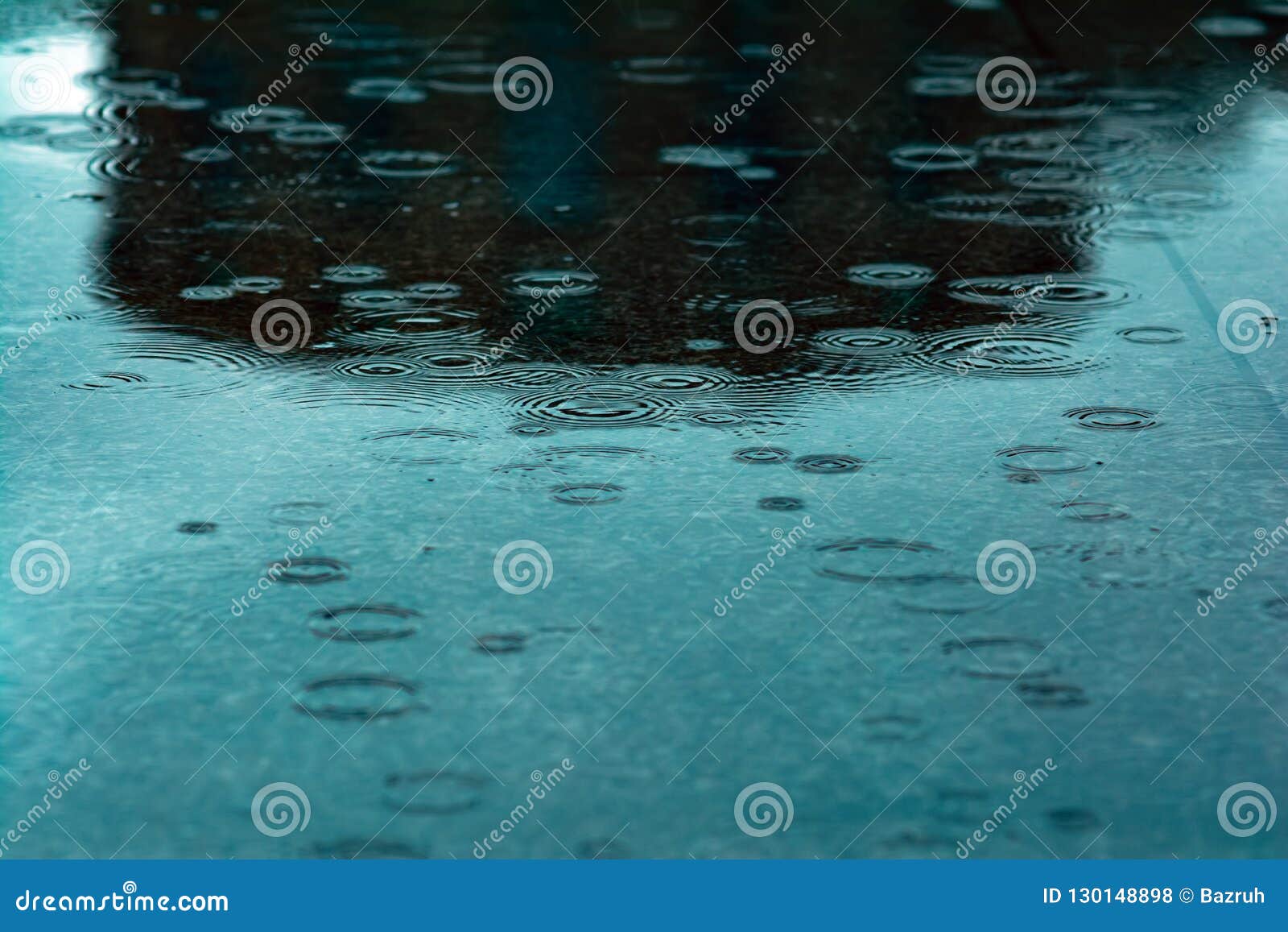 Splashes and Raindrops in a Puddle Stock Photo - Image of reflection ...