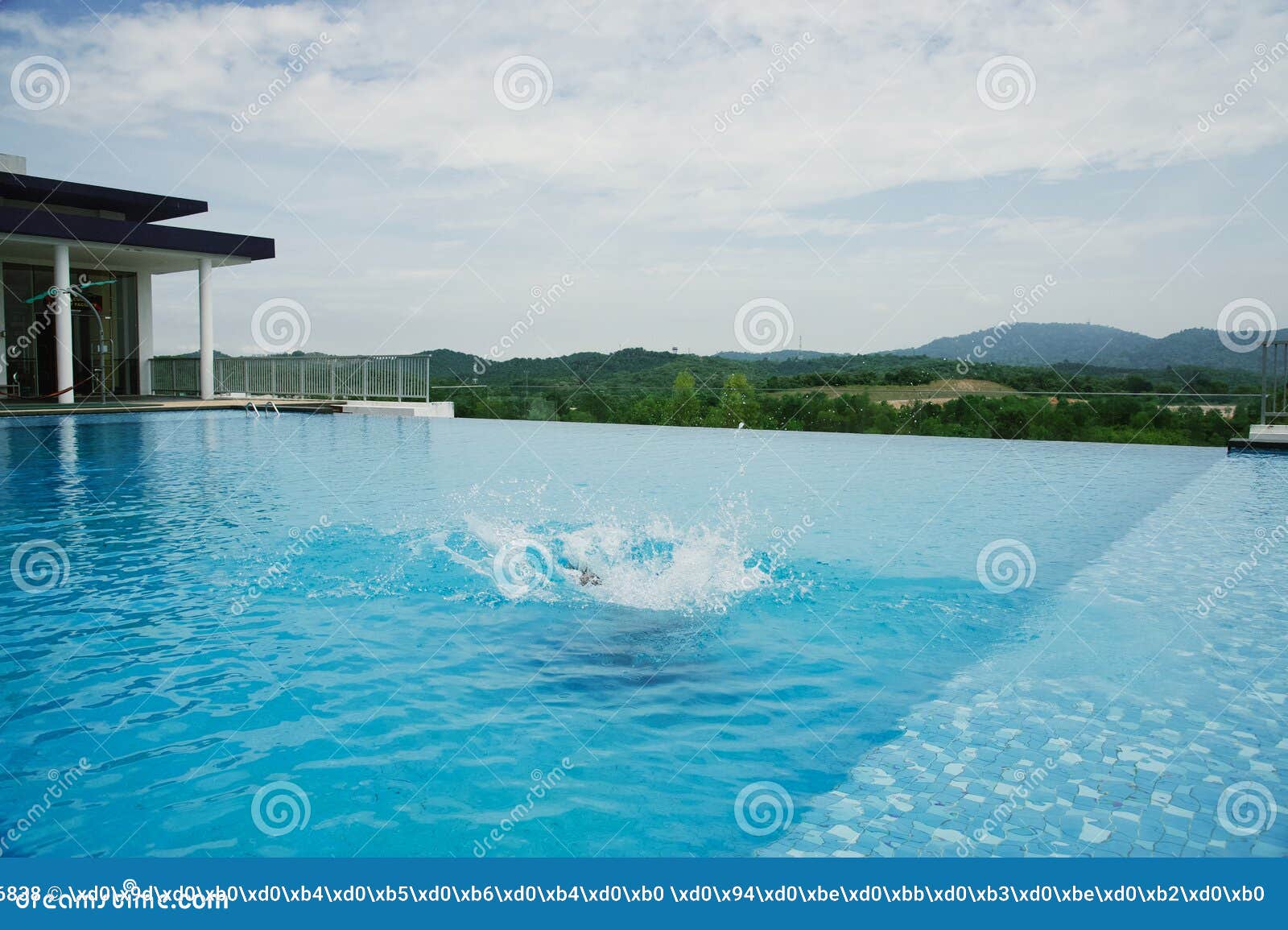 Splashes of Water from Diving in the Pool in a Luxury Resort Hotel ...