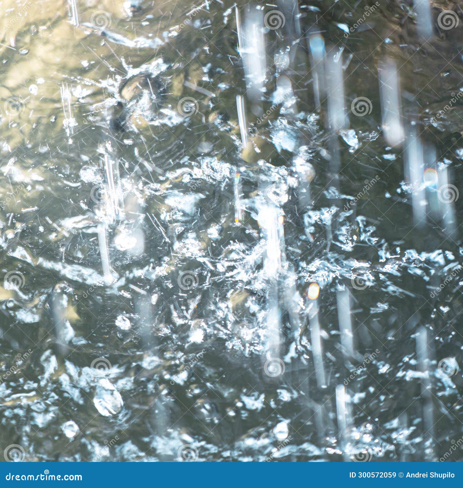 Splashes of Water in a Puddle from Rain As an Abstract Background Stock ...