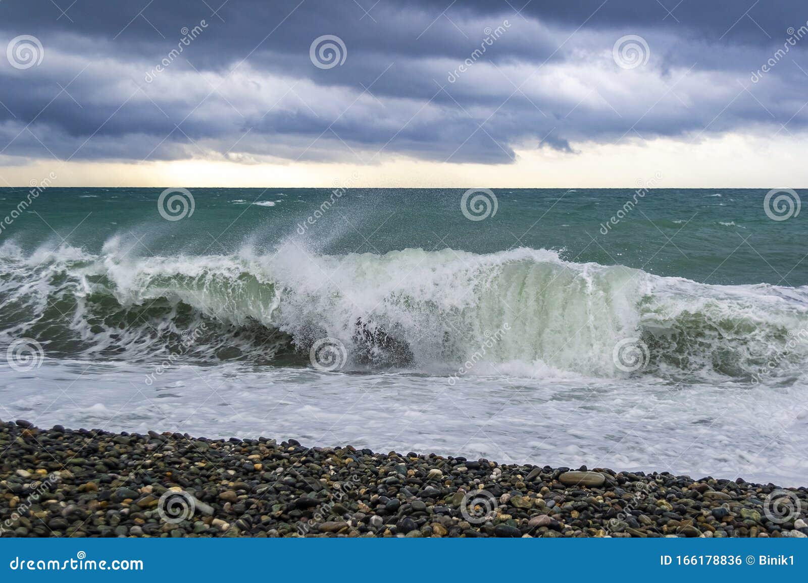 Splashes of Waves during Stormy Wind in the Sea at Pebble Beach. Stock ...