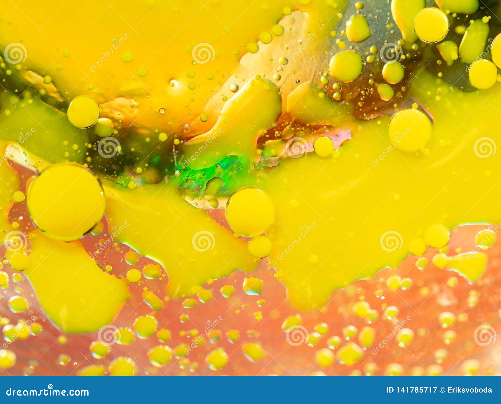 Splashes of Yellow Paint on Multicolour Abstract Background. Close Up ...