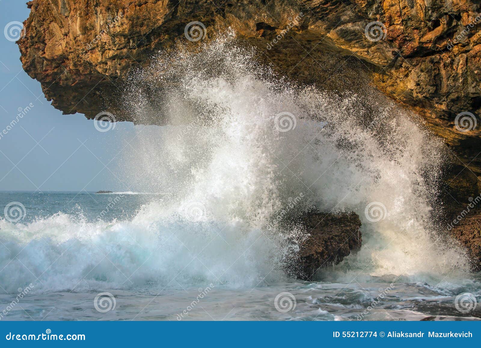 A Splashing Big Wave Crashing into the Rocks Stock Photo - Image of ...
