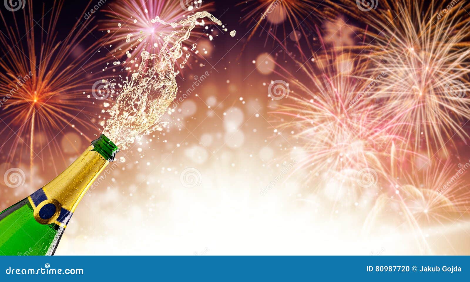 Splashing Bottle of Champagne Over Fireworks Background Stock Photo ...