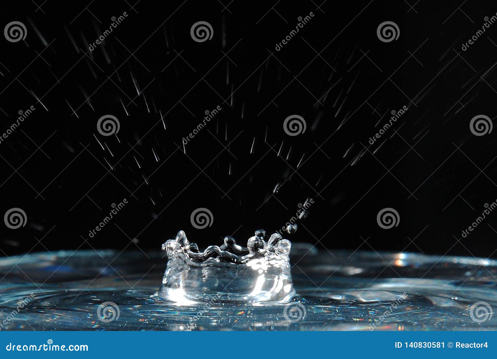Splashing a drop of water stock image. Image of background - 140830581