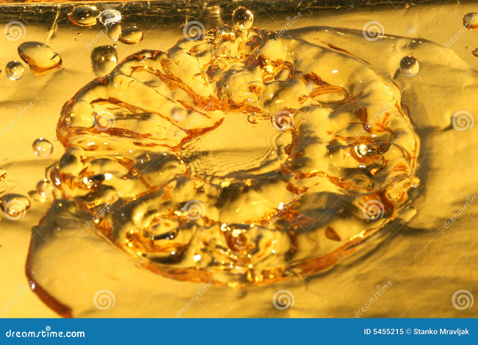 Splashing golden water stock image. Image of clear, liquid - 5455215