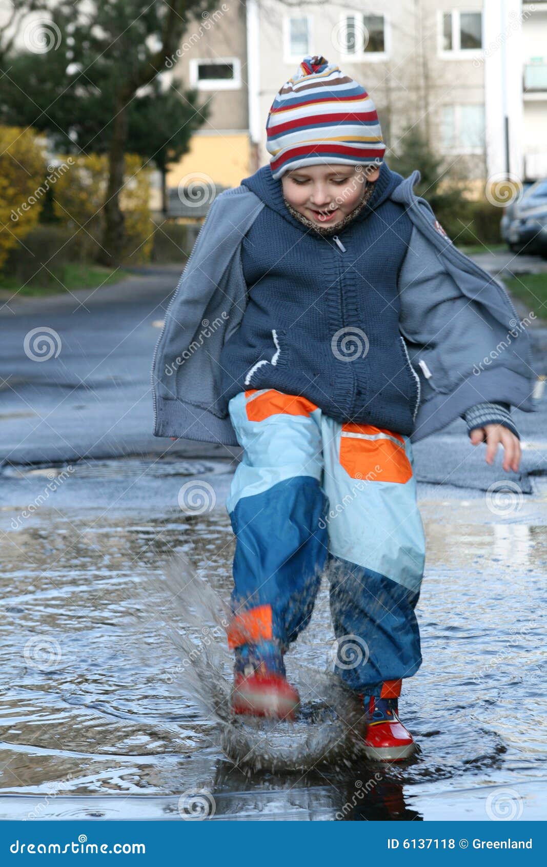 Splashing in a mud puddle stock photo. Image of funny - 6137118