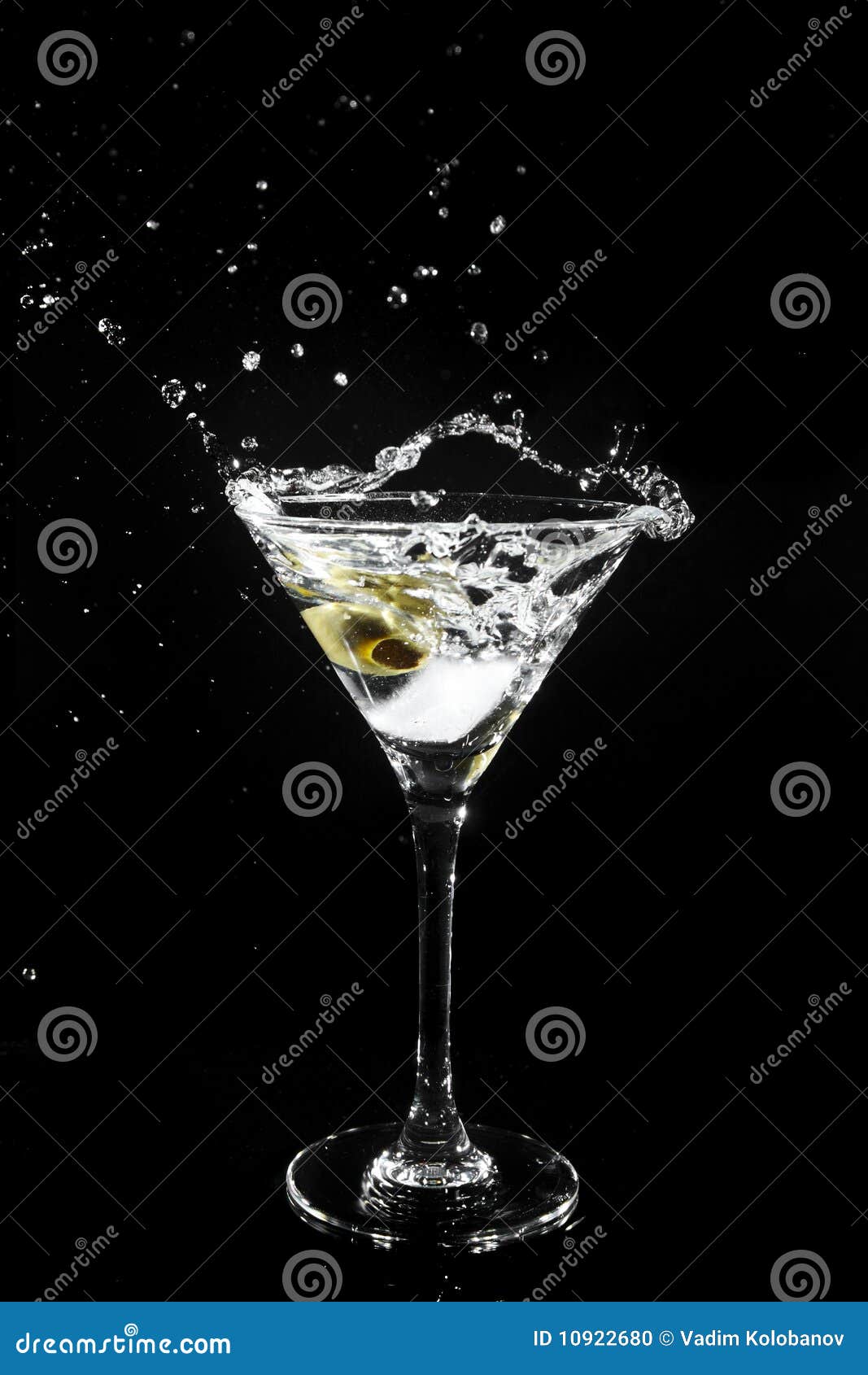 Splashing Olive into a Martini Glass Stock Photo - Image of concoct ...