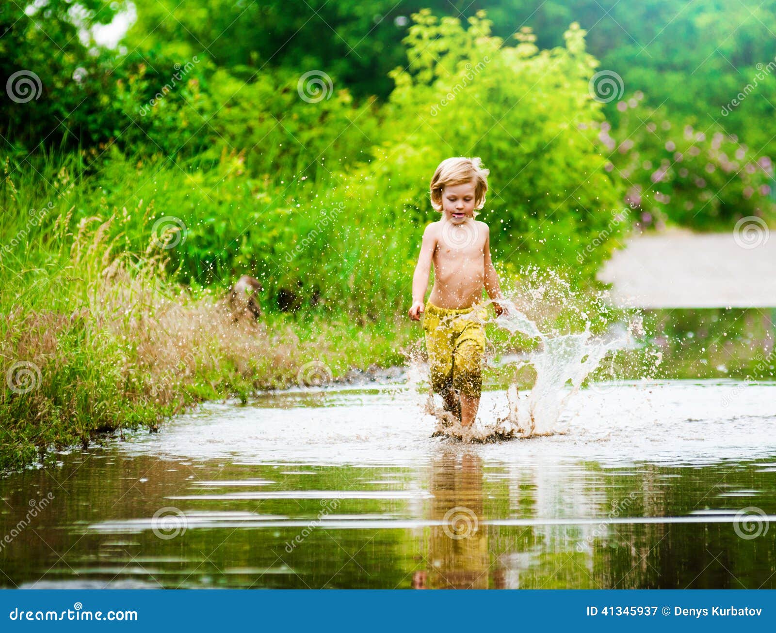 Splashing in a puddle stock image. Image of smiling, happy - 41345937