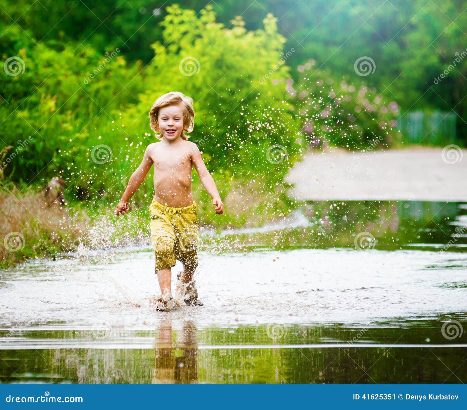 Splashing in a puddle stock image. Image of play, jump - 41625351