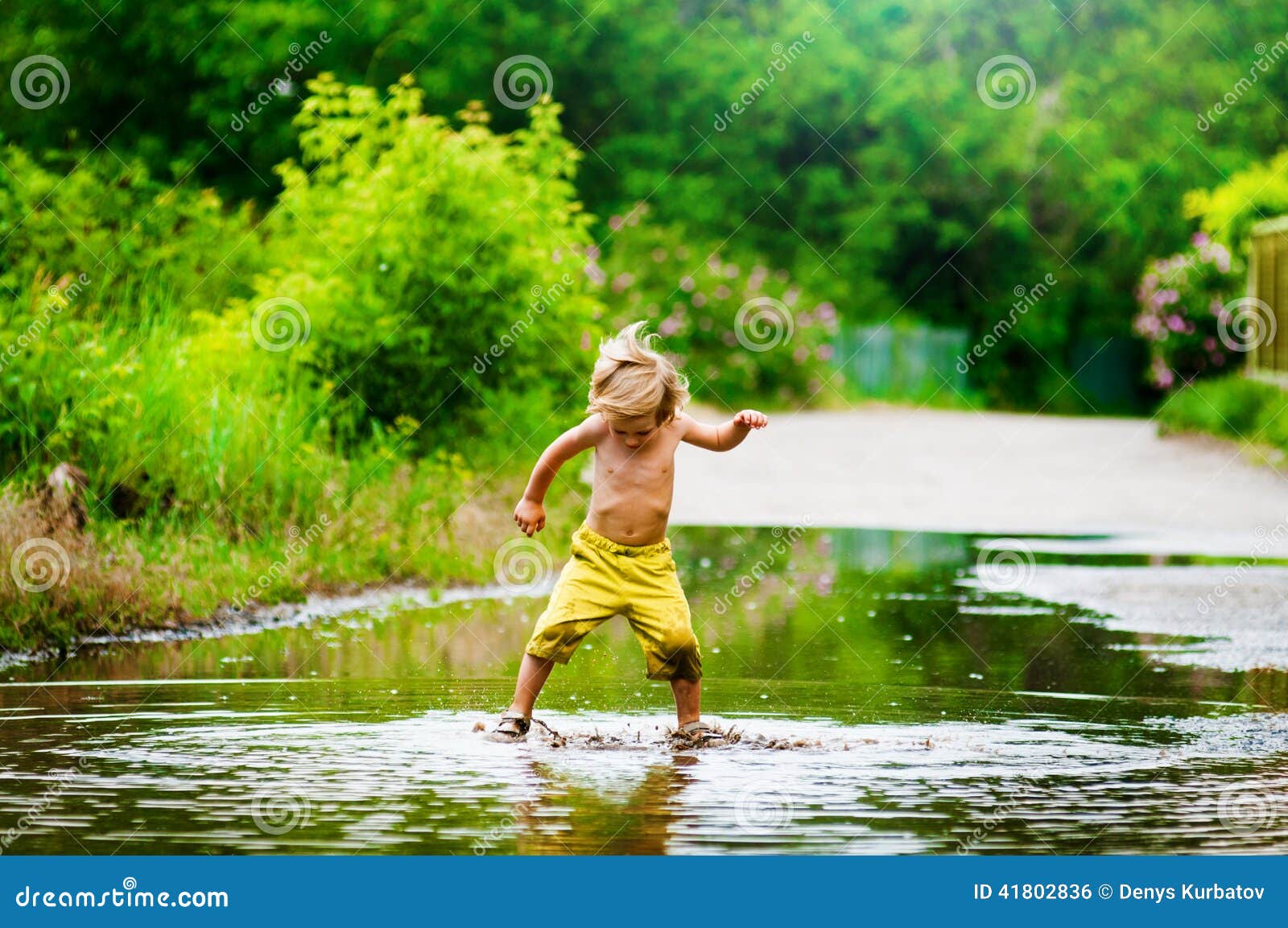 Splashing in a puddle stock photo. Image of outdoors - 41802836