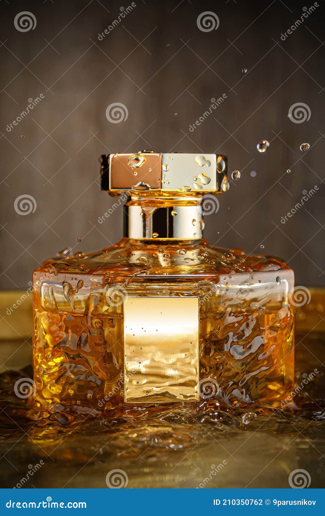 Splashing Water Around the Golden Perfume Bottle Stock Photo - Image of ...