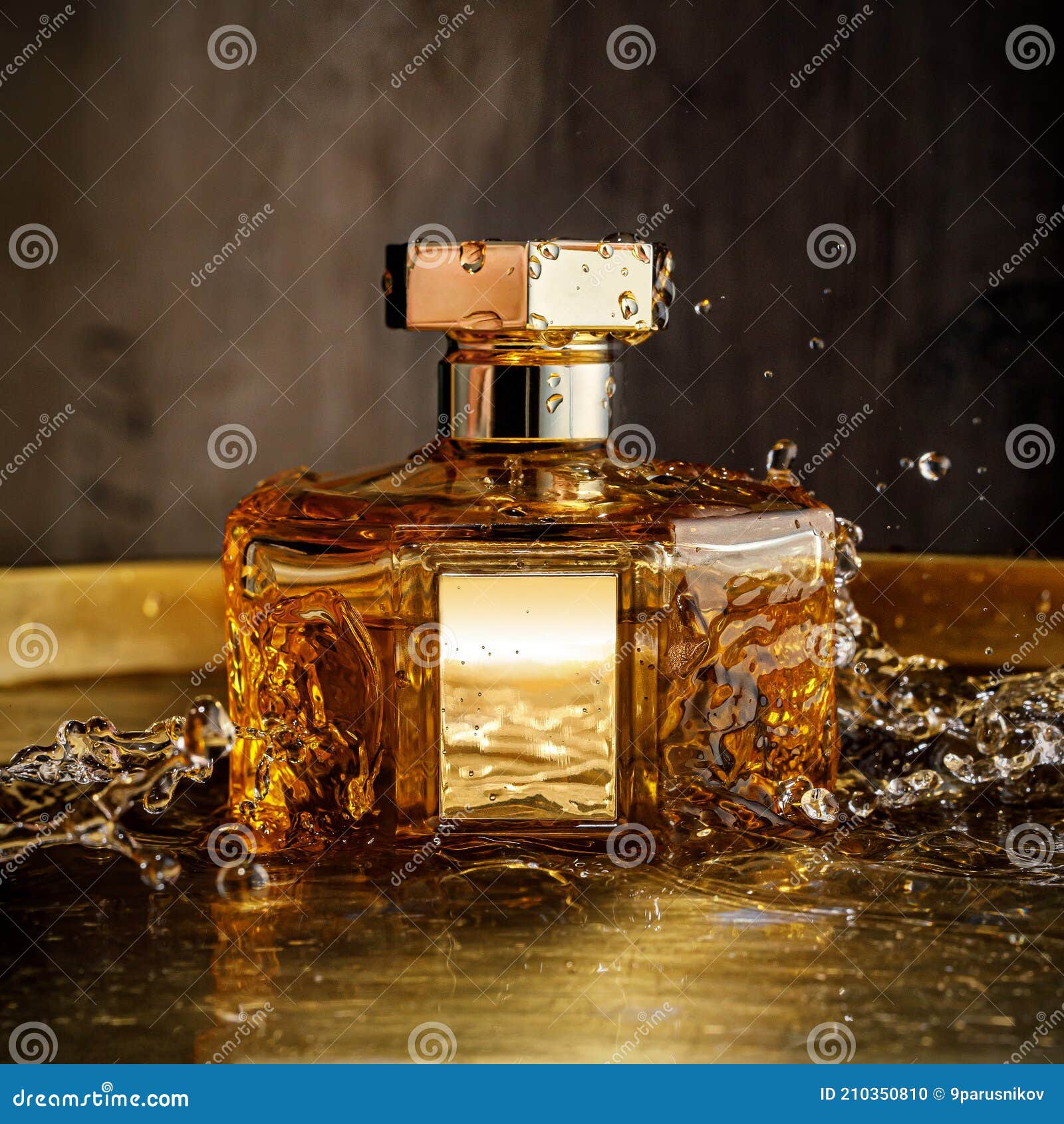 Splashing Water Around the Golden Perfume Bottle Stock Photo - Image of ...