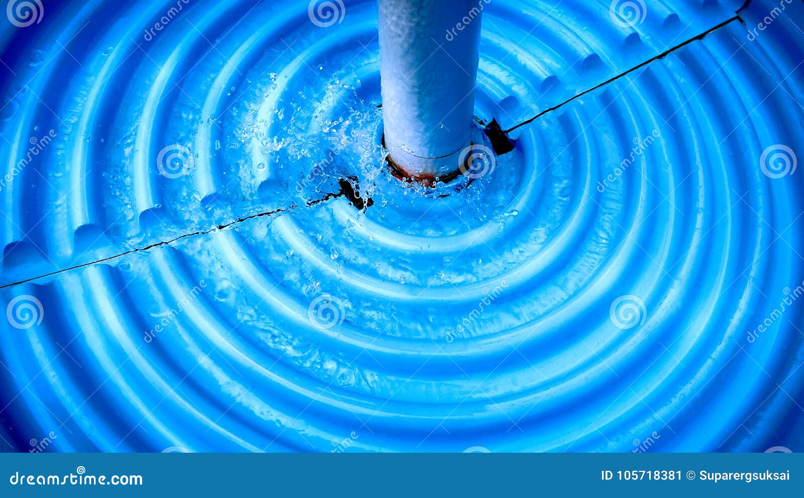 Splashing Water on Blue Round Grooved Bath for Decoration Stock Image ...