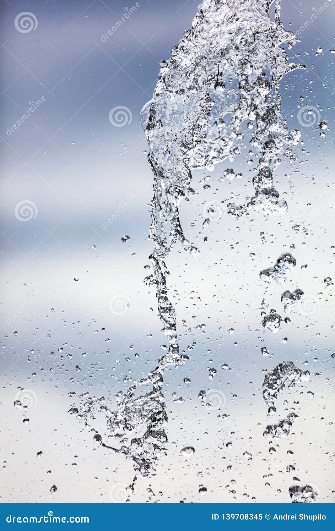 Splashing Water with Drops on the Sky Background Stock Image - Image of ...