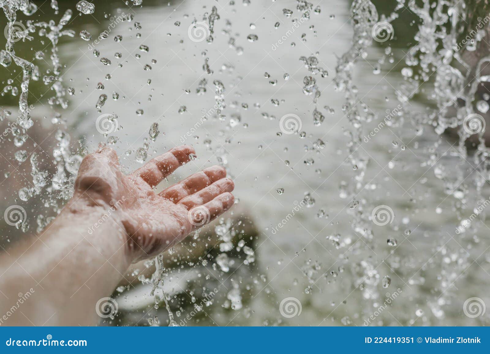 Splashing Water Falling on a Man`s Hand from a Waterfall Stock Image ...