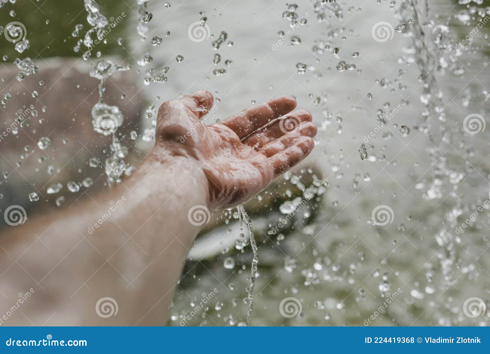 Splashing Water Falling on a Man`s Hand from a Waterfall Stock Photo ...