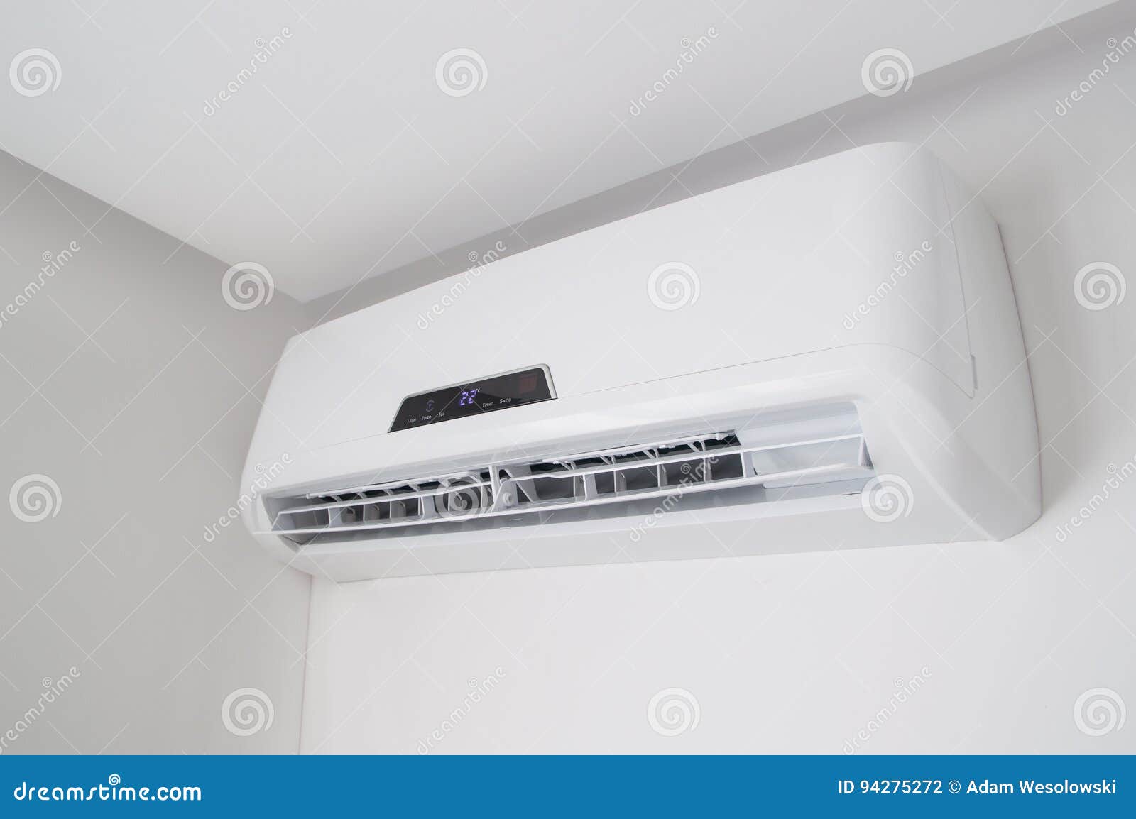 Split Air Conditioner on a White Wall in Flat Indoors Stock Photo ...