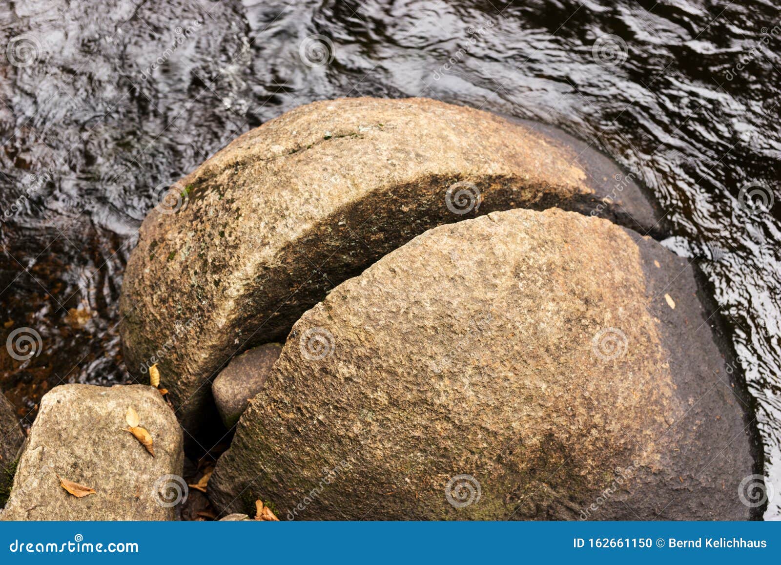 Split Big Round Stone in the River Stock Photo - Image of mysterious ...