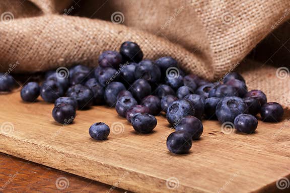 Split Blueberries on a Rustic Wooden Background Stock Photo - Image of ...