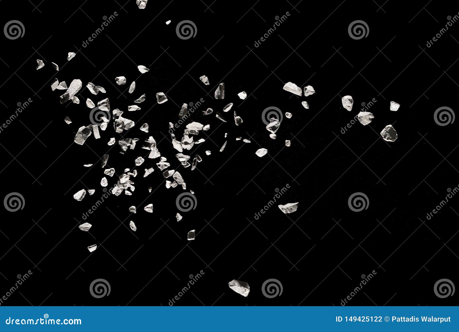 Split Debris of Stone Exploding Against Black Background Stock Photo ...