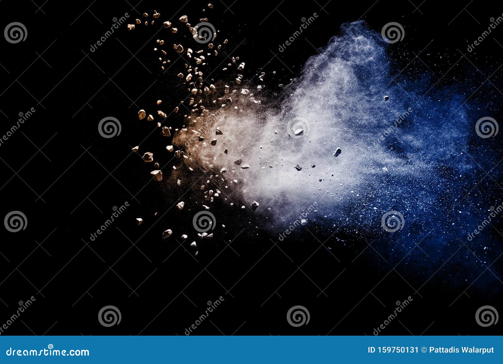 Split Debris Of Stone Exploding With Blue Powder Against Black ...