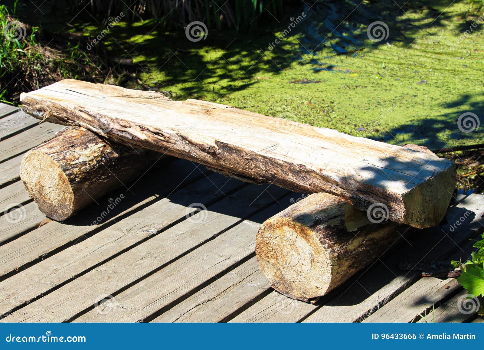 A Split Log Wooden Bench on a Boardwalk Trail Stock Photo - Image of ...