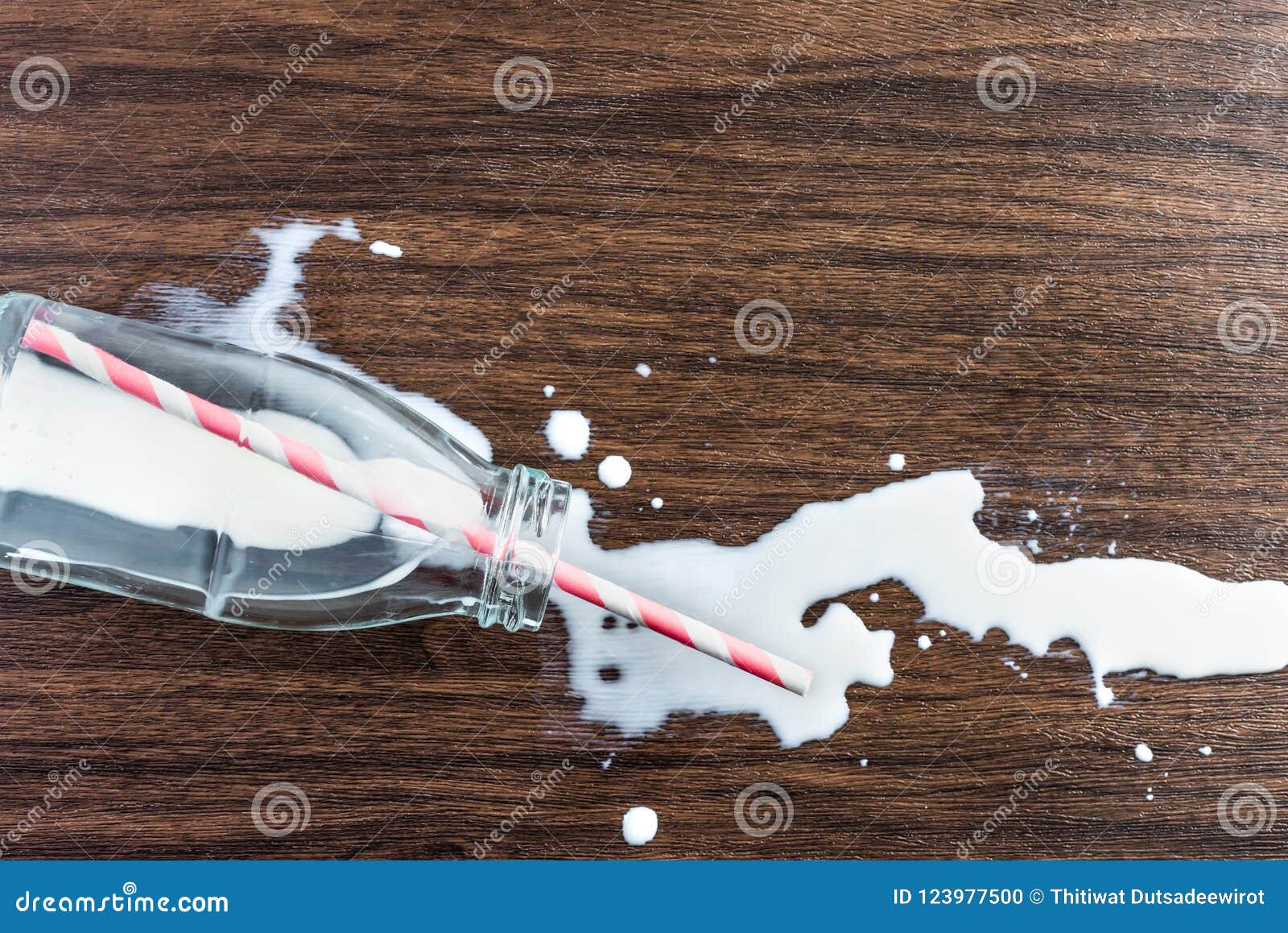 Spilt milk from bottle stock photo. Image of falling - 123977500