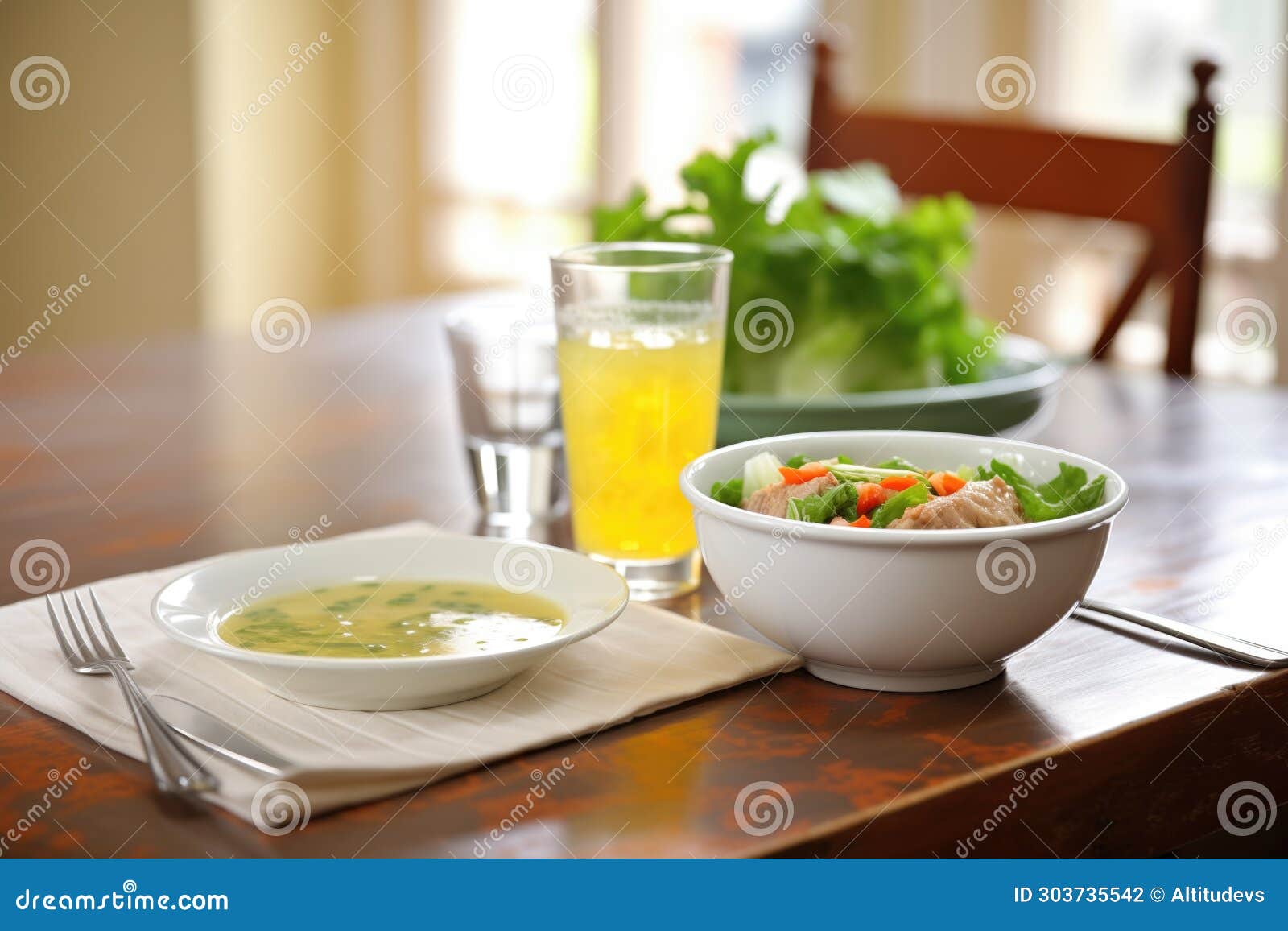 Split Pea Soup Meal with Salad and Water Glass, Lunch Setting Stock ...