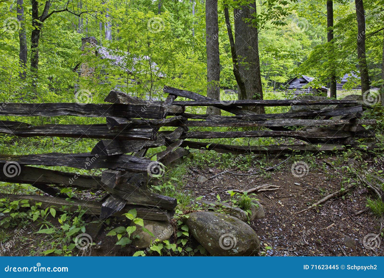 Split Rail Fence with Cabins in Background Stock Image - Image of fence ...