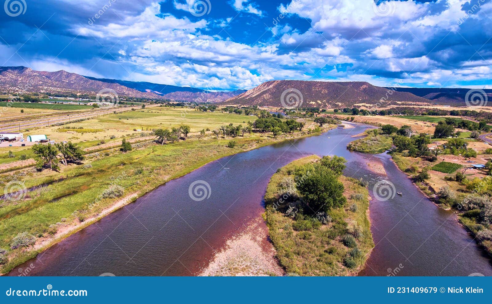 Split River through Lush Forest by Desert Mountains Stock Image - Image ...