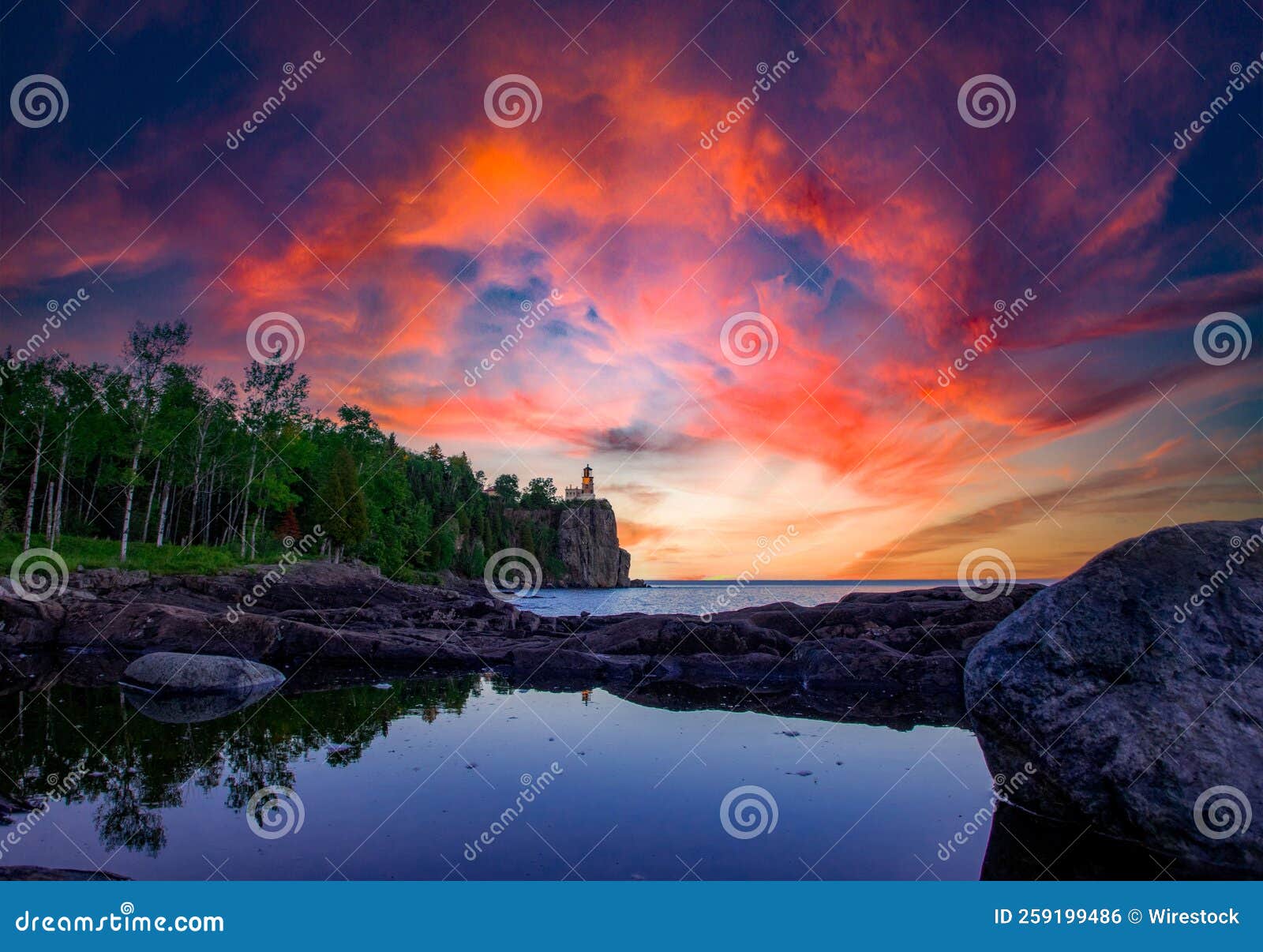 Split Rock Lighthouse on the Cliff Under the Orange and Blue Sunset Sky ...