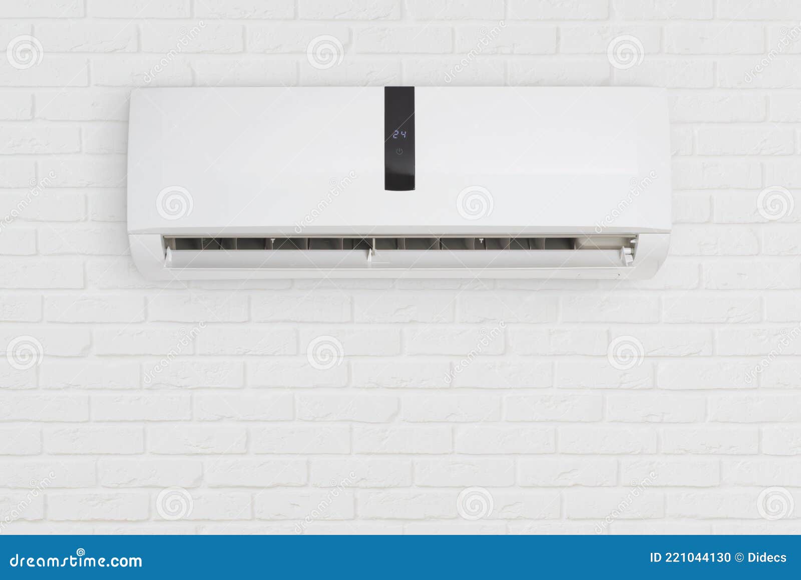 Split System Air Conditioning Unit on Decorative White Brick Wall Stock ...