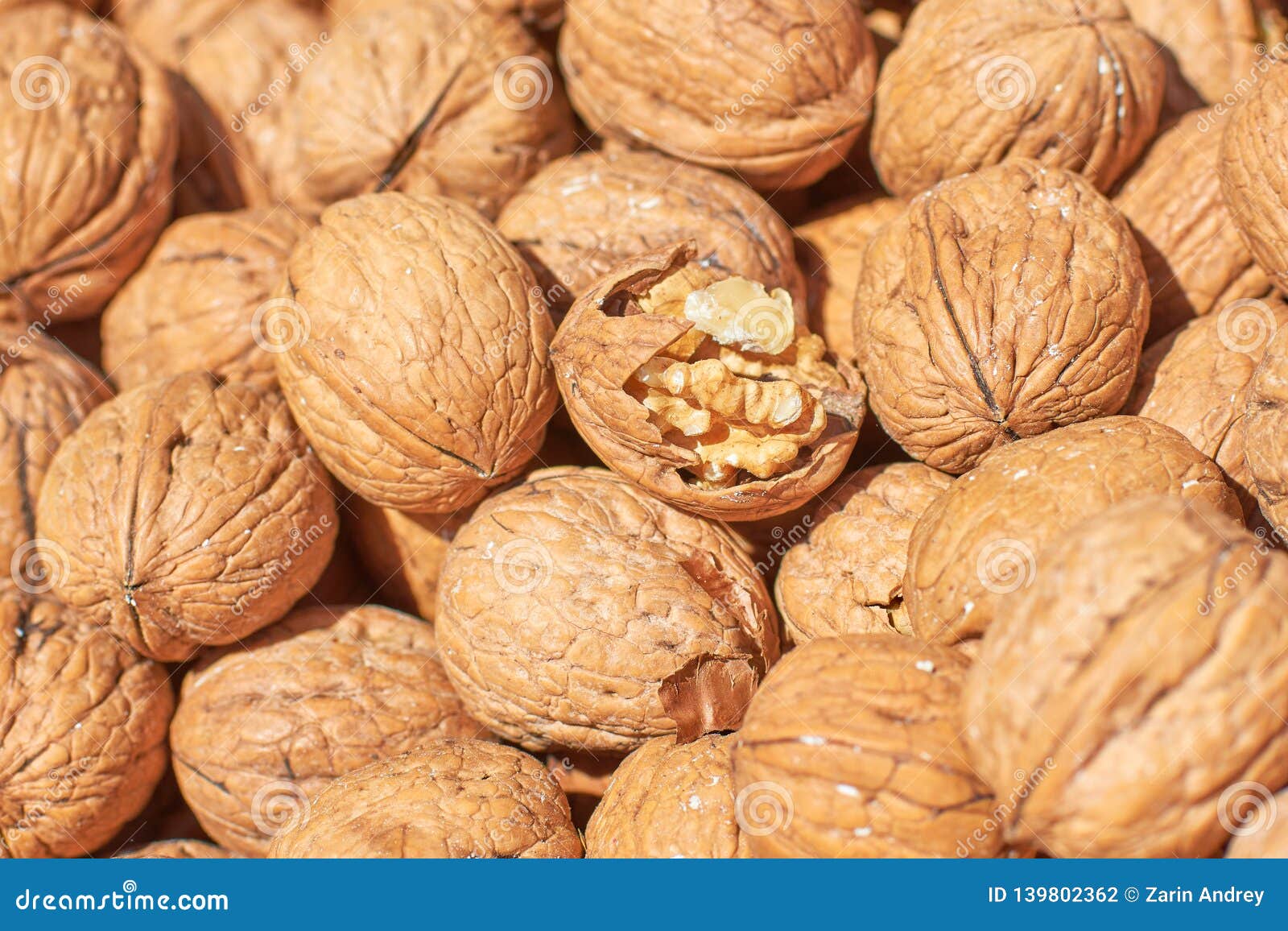 Split Walnut on the Background of Whole Nuts, Concept: Shared ...