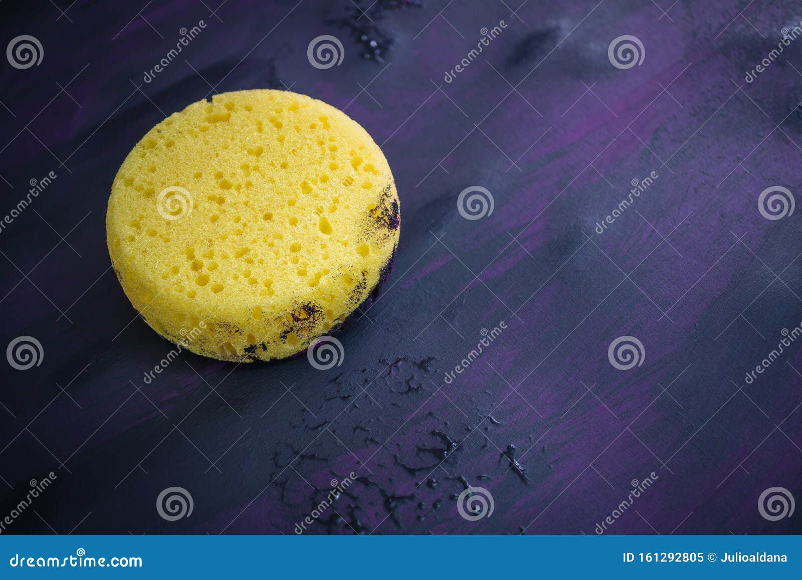 Sponge on Canvas Applying Texture with Black and Purple Paint. Stock ...