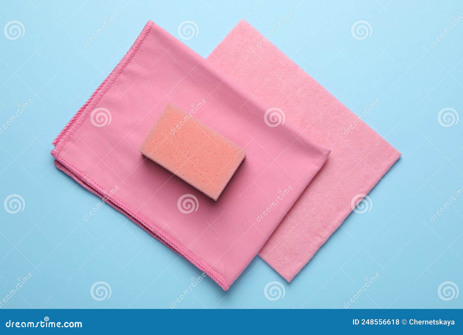 Sponge and Rags on Light Blue Background, Top View Stock Photo - Image ...