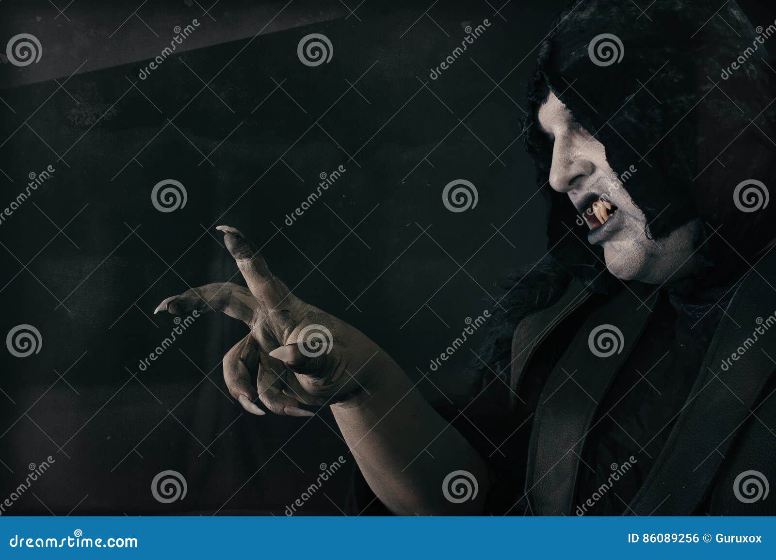 Spooky Devil Vamp with Large Scary Nails. Hell and Horror Stock Photo ...